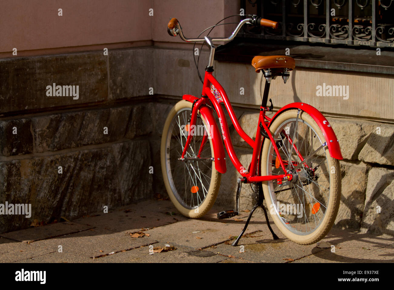 funky bicycle on old street sun shadow on stand Stock Photo - Alamy