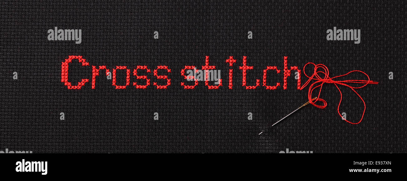 The embroidered word "Cross-Stitch" on black canvas Stock Photo - Alamy