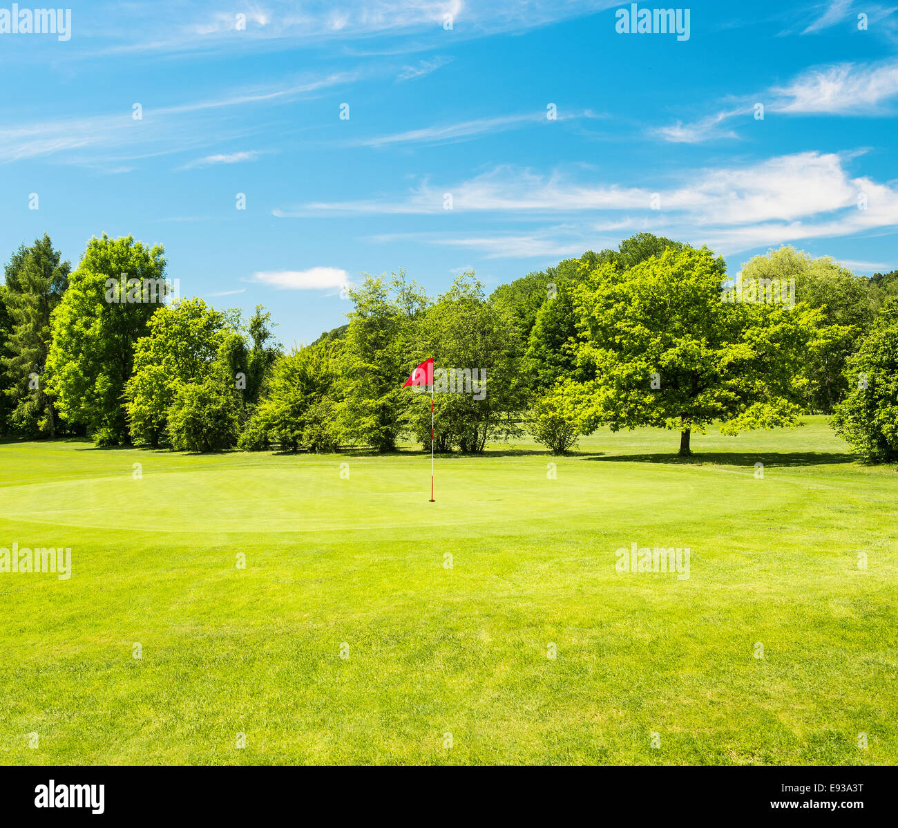 green field and beautiful blue sky. european golf course landscape ...