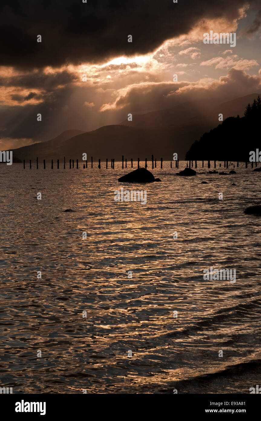 Sunset over Loch Tay Crannog remains Stock Photo - Alamy