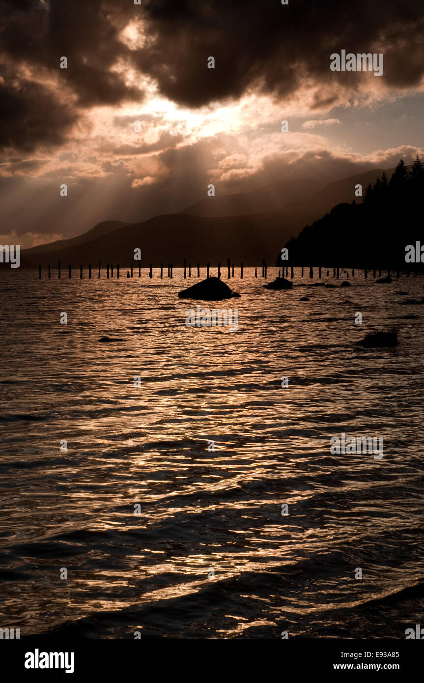 Sunset over Loch Tay Crannog remains Stock Photo - Alamy