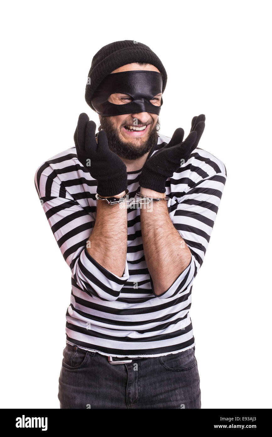 Sad thief with handcuffs. Portrait isolated on white background Stock ...