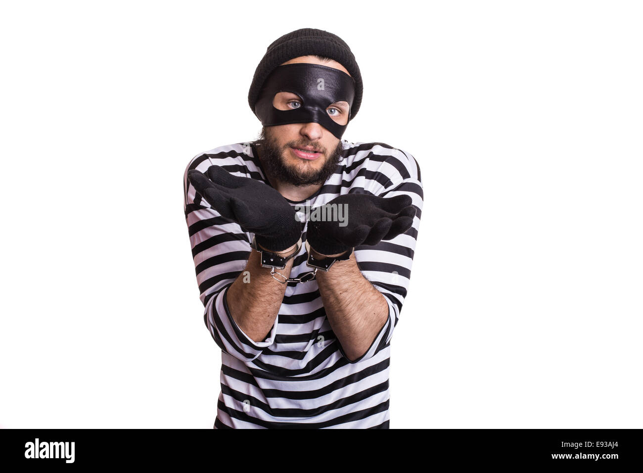 Sad criminal with handcuffs. Portrait isolated on white background ...