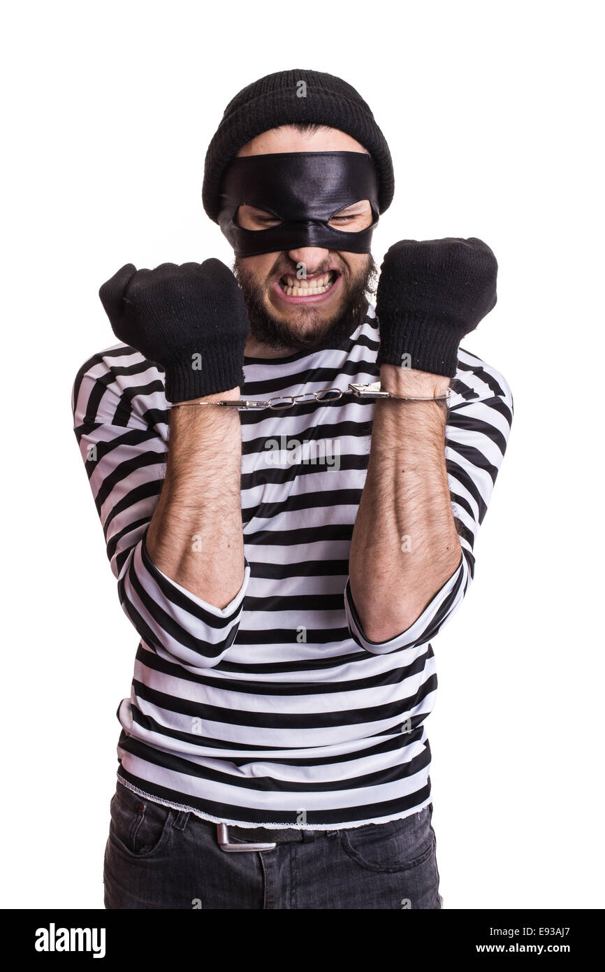 Angry robber with handcuffs. Portrait isolated on white background ...