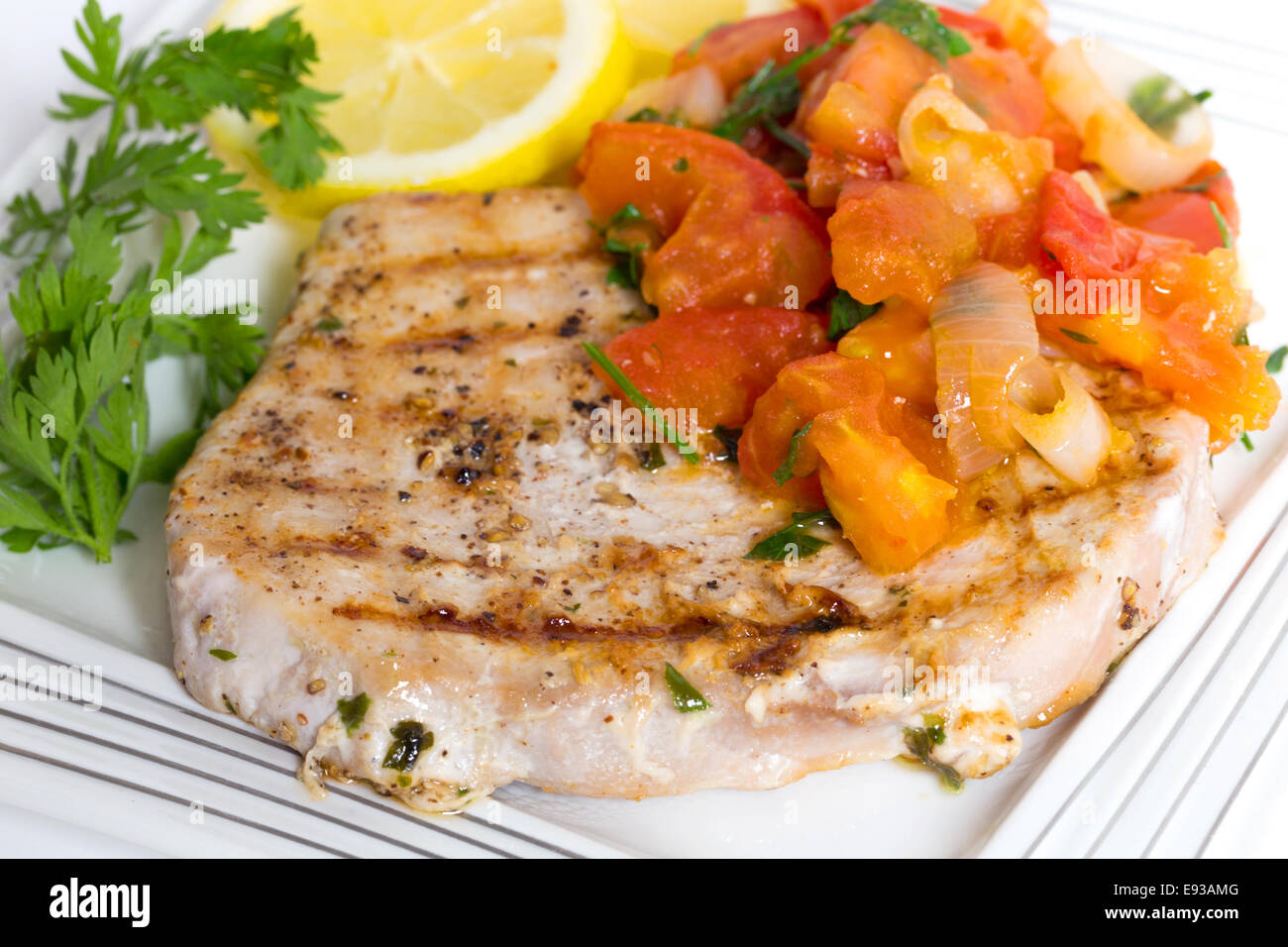 Grilled marlin steak served with an onion, garlic and tomato salsa ...