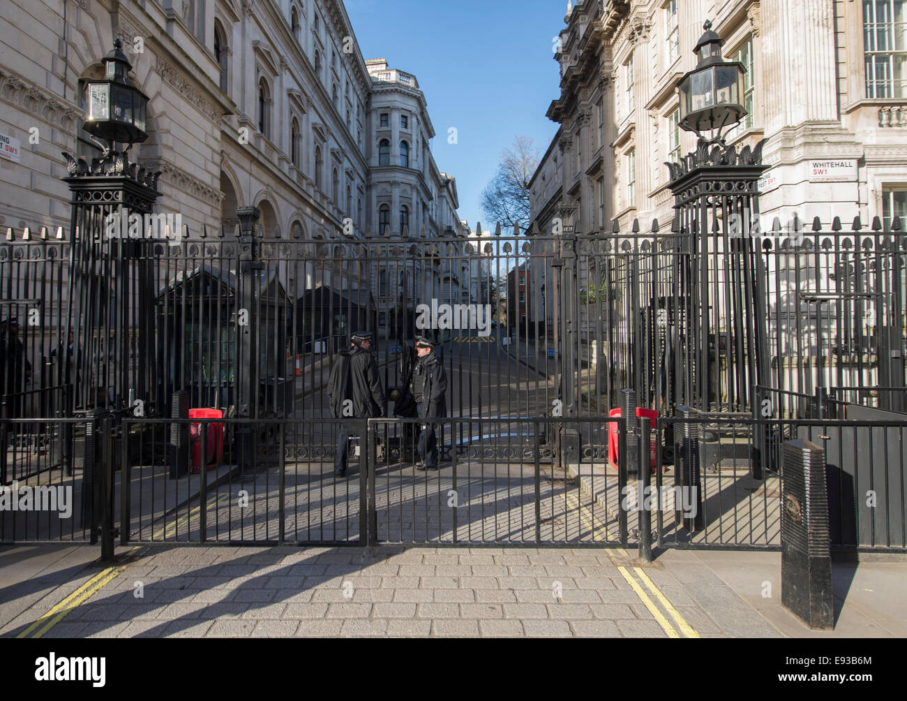 Security gates and armed Metropolitan Police at the entrance to Downing ...