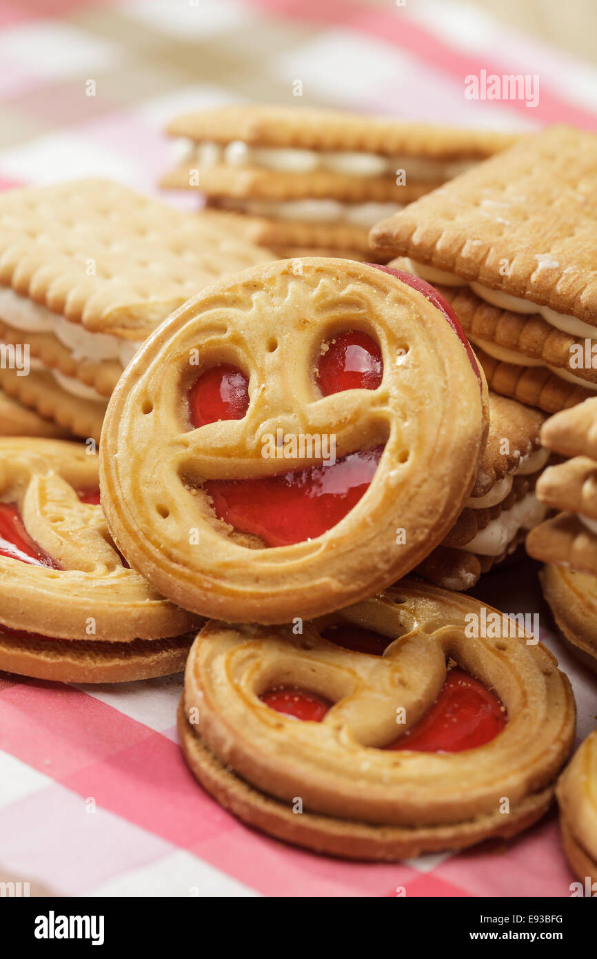Smiling cookie face on a table Stock Photo - Alamy