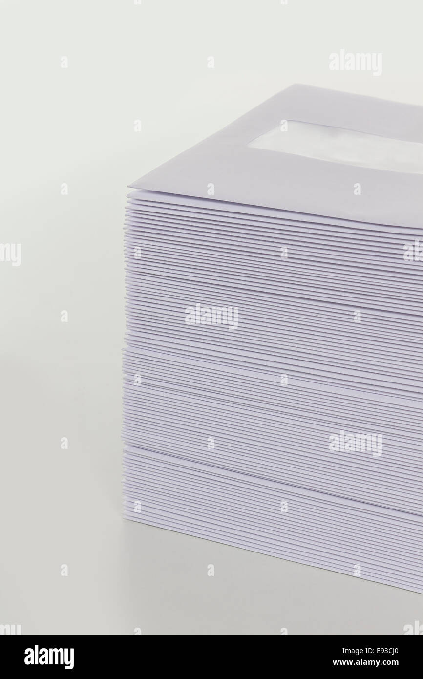 Stack of DIN A5 Envelopes on a white Table Stock Photo - Alamy