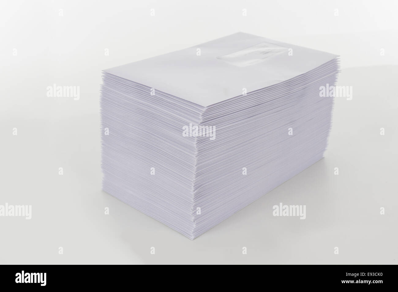 Stack of DIN A5 Envelopes on a white Table Stock Photo - Alamy