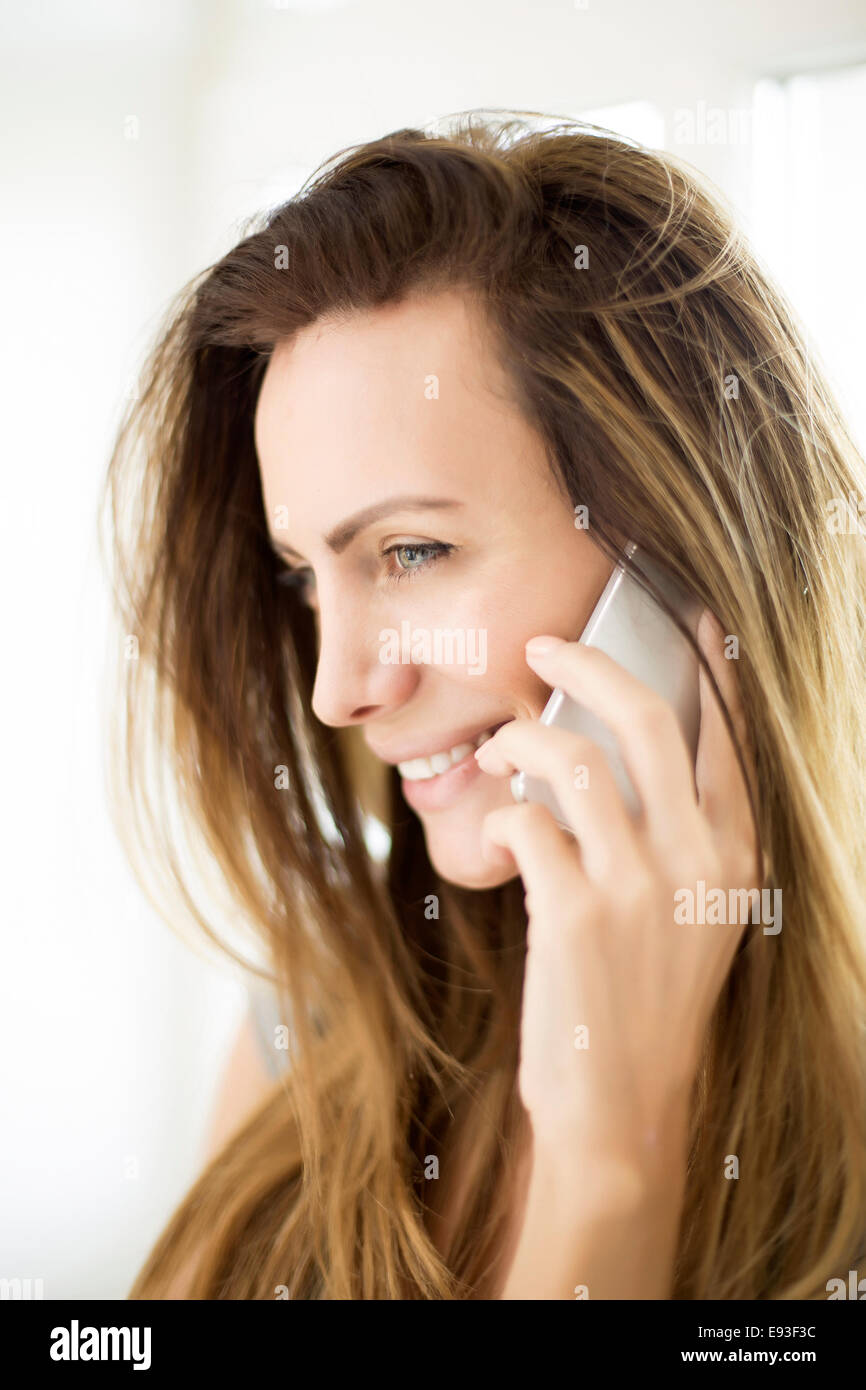 Pretty young woman talking on the mobile phone Stock Photo - Alamy
