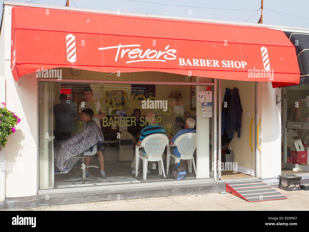 Parade shops stores shopping small shops St. Brelade Stock Photo - Alamy