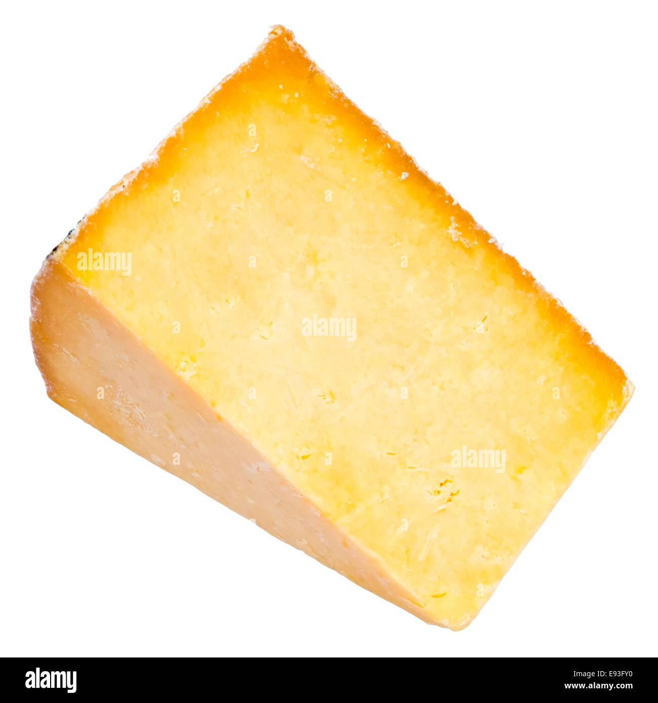 Wedge of Red Leicester cheese cut out or isolated against a white ...