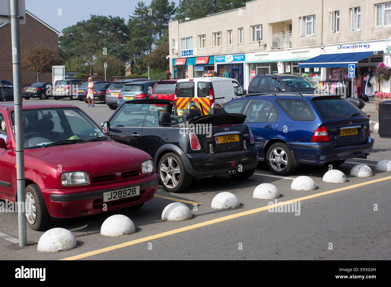 Parade shops stores shopping small shops St. Brelade Stock Photo - Alamy