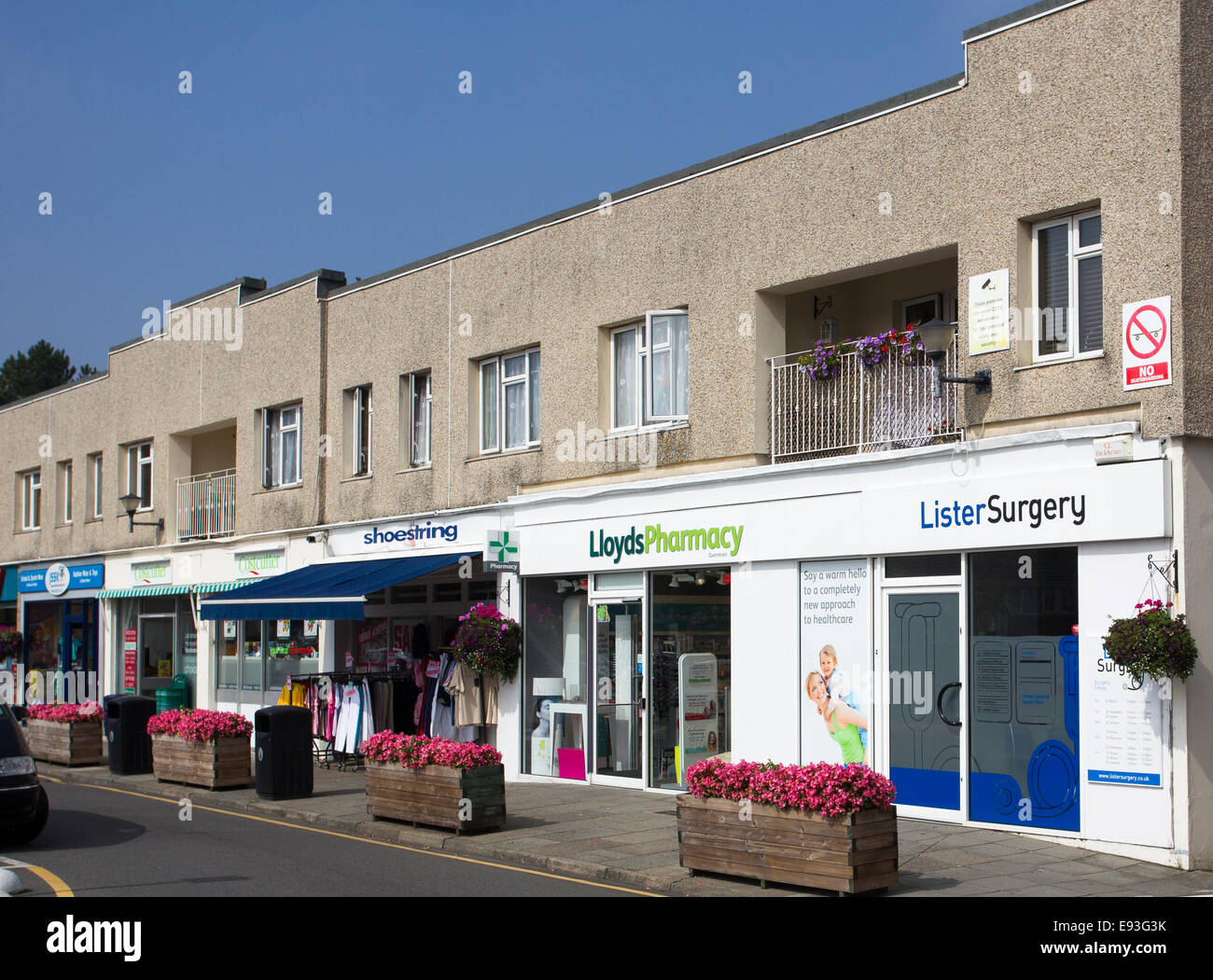Parade shops stores shopping small shops St. Brelade Stock Photo - Alamy