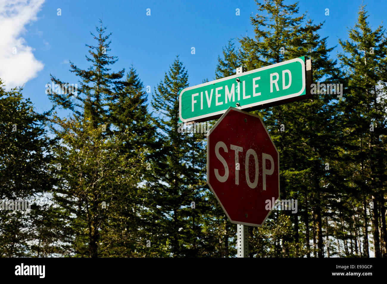 Stop road sign at junction of Five Mile Rd and Highway 101 Oregon Stock ...