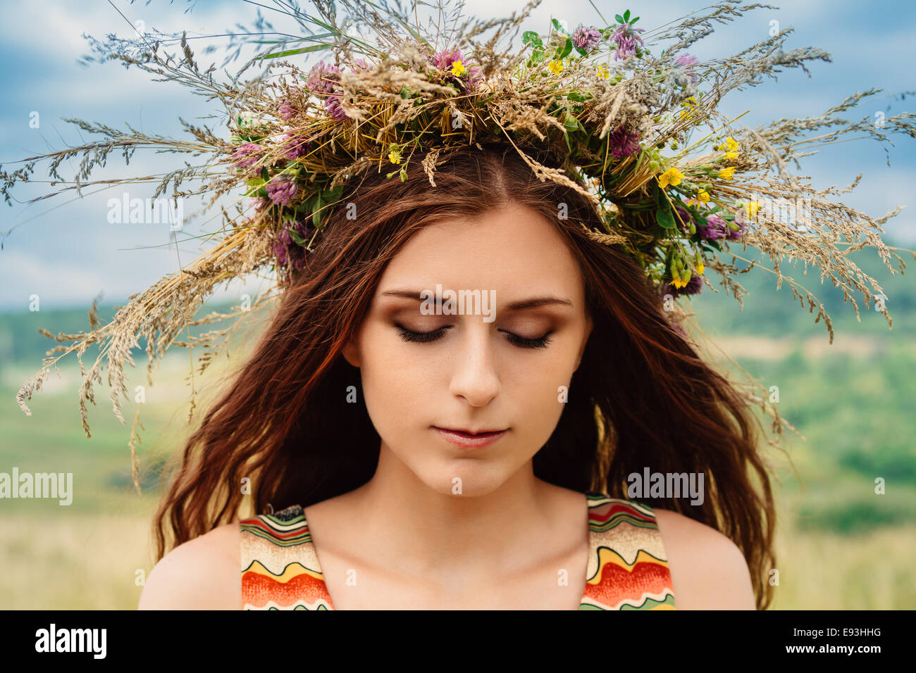 Woman walking in field Stock Photo - Alamy