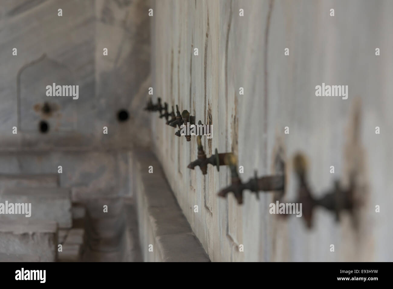 A line of taps in a mosque where Muslims carry out ablution by washing ...