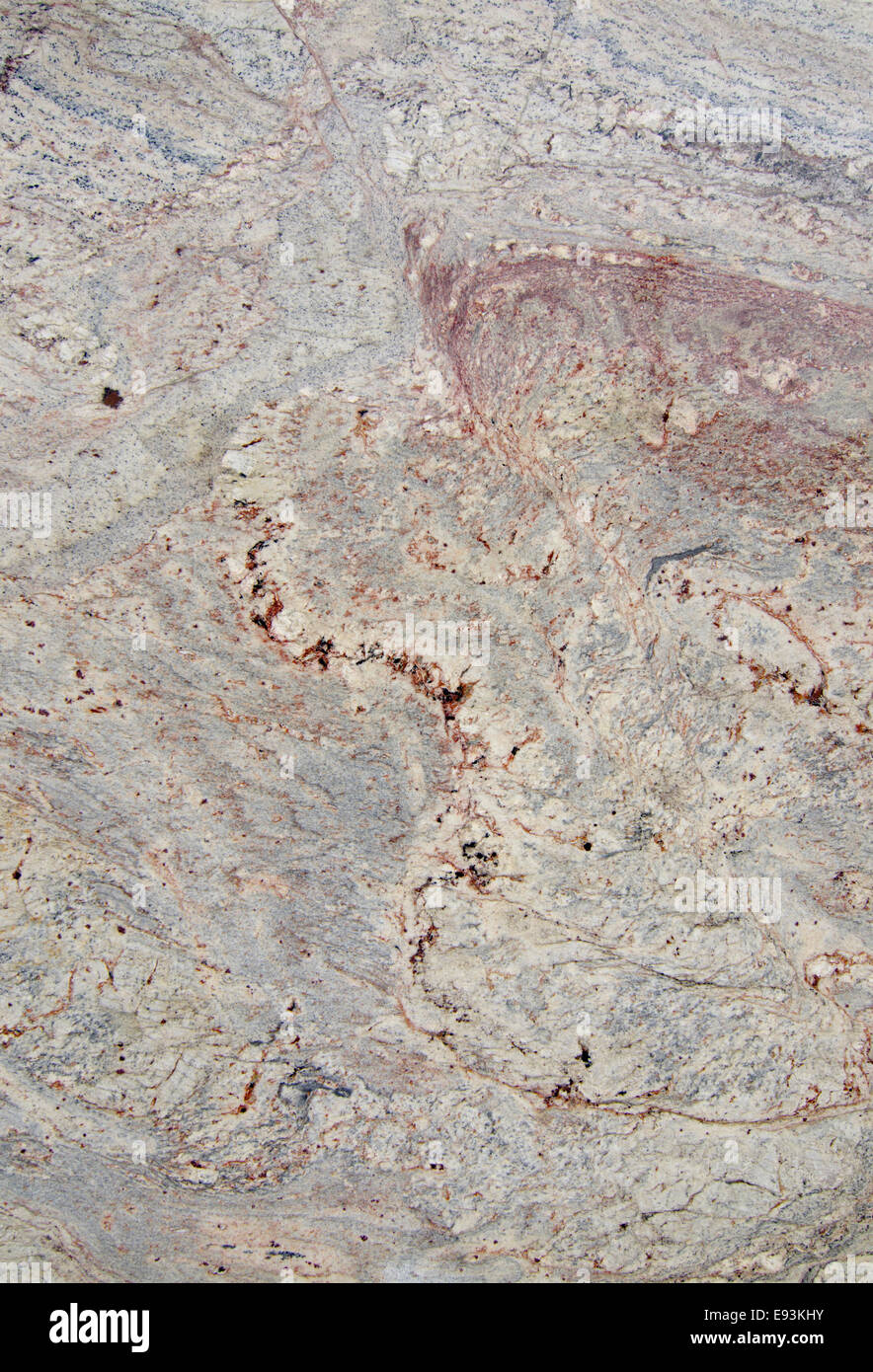 A full slab of cut and polished Granite makes a background of textures ...