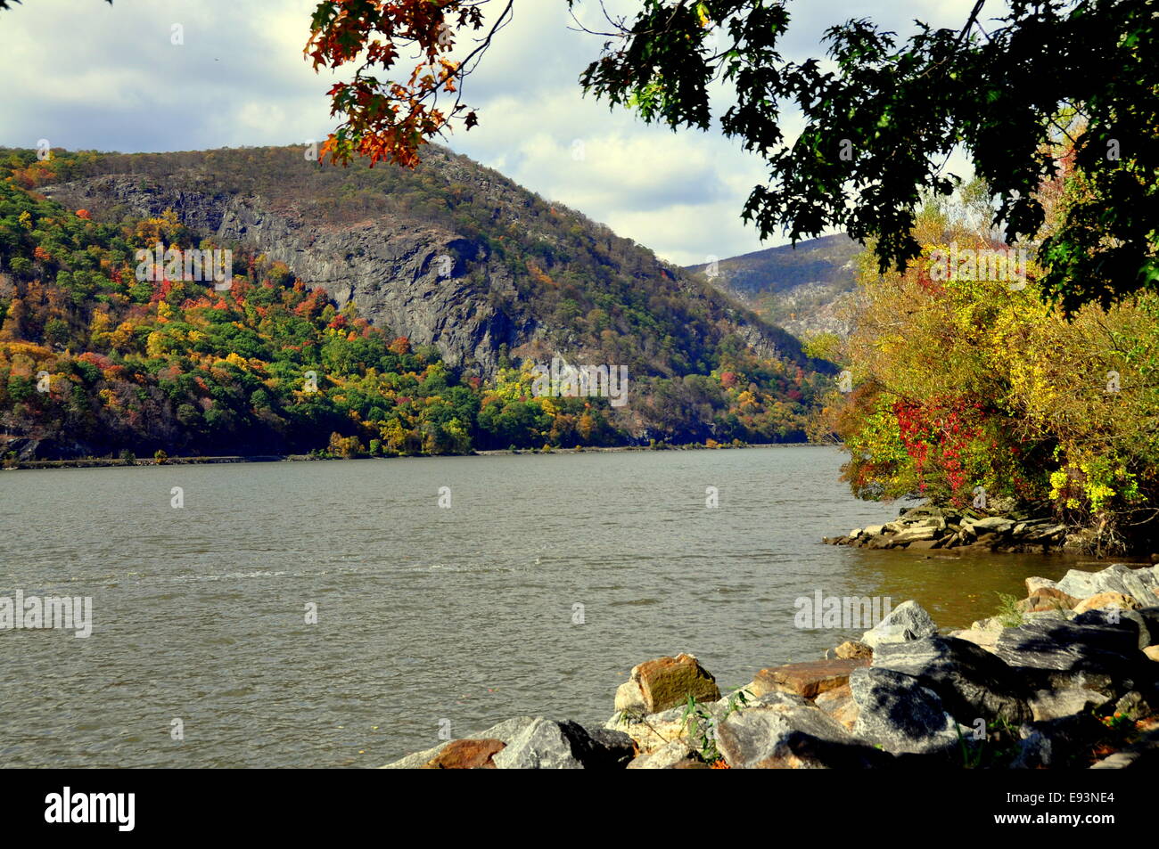 Cold Spring, NY: View of the Hudson River lined with trees and rocks ...