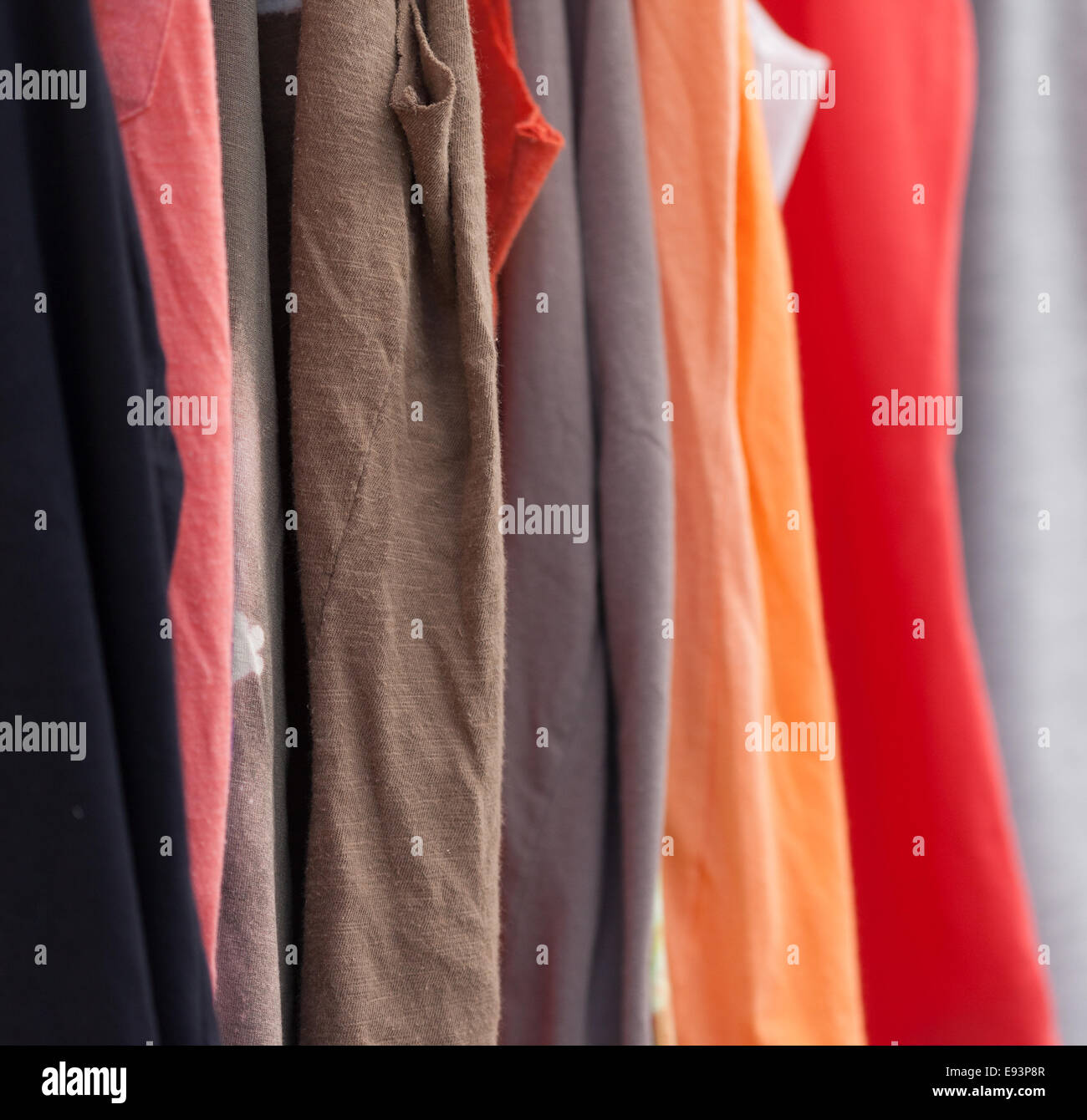 Assortment of shirts for sale at a street fair Stock Photo - Alamy