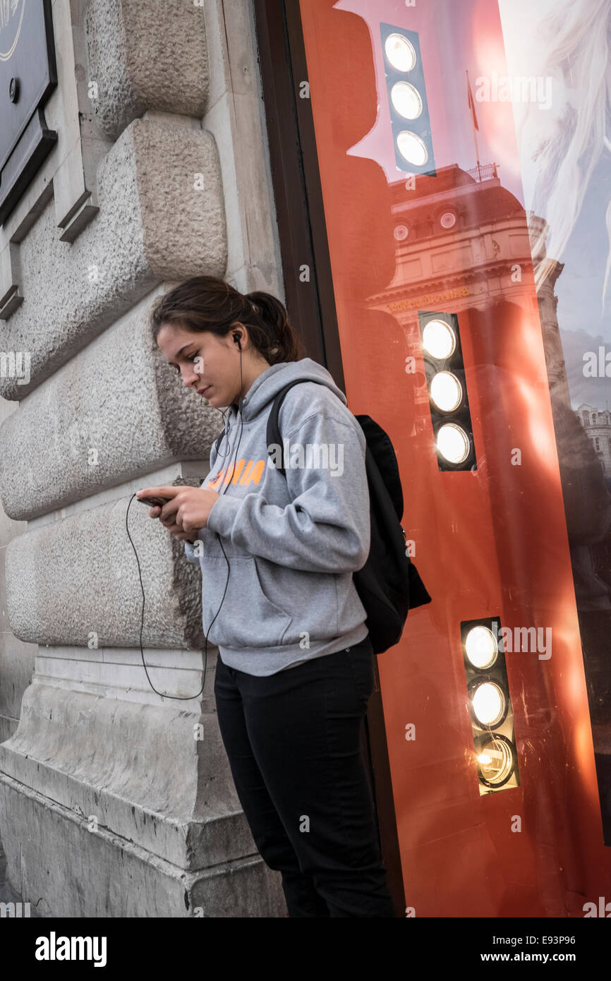 Street photography shots of people using their mobile telephones in ...
