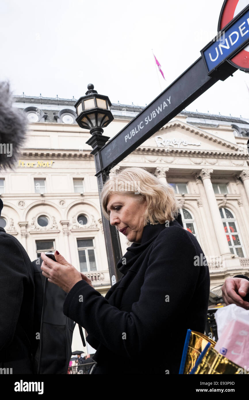 Street photography shots of people using their mobile telephones in ...