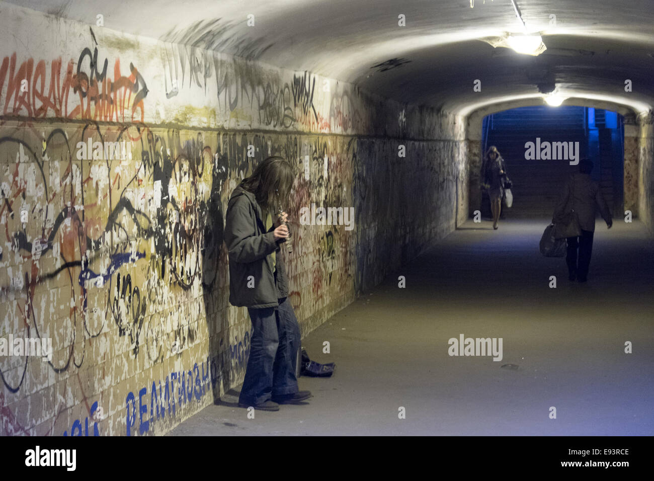 dirty homeless micician playing on flute Stock Photo - Alamy