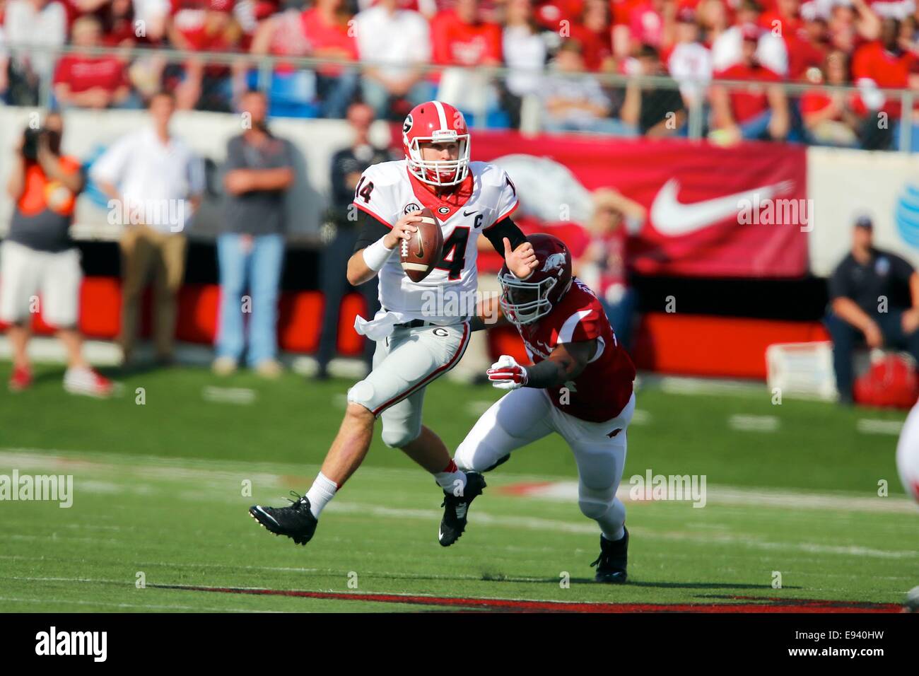 Little Rock, AR. 18th Oct, 2014. Bulldog QB Hutson Mason #14 looks to ...