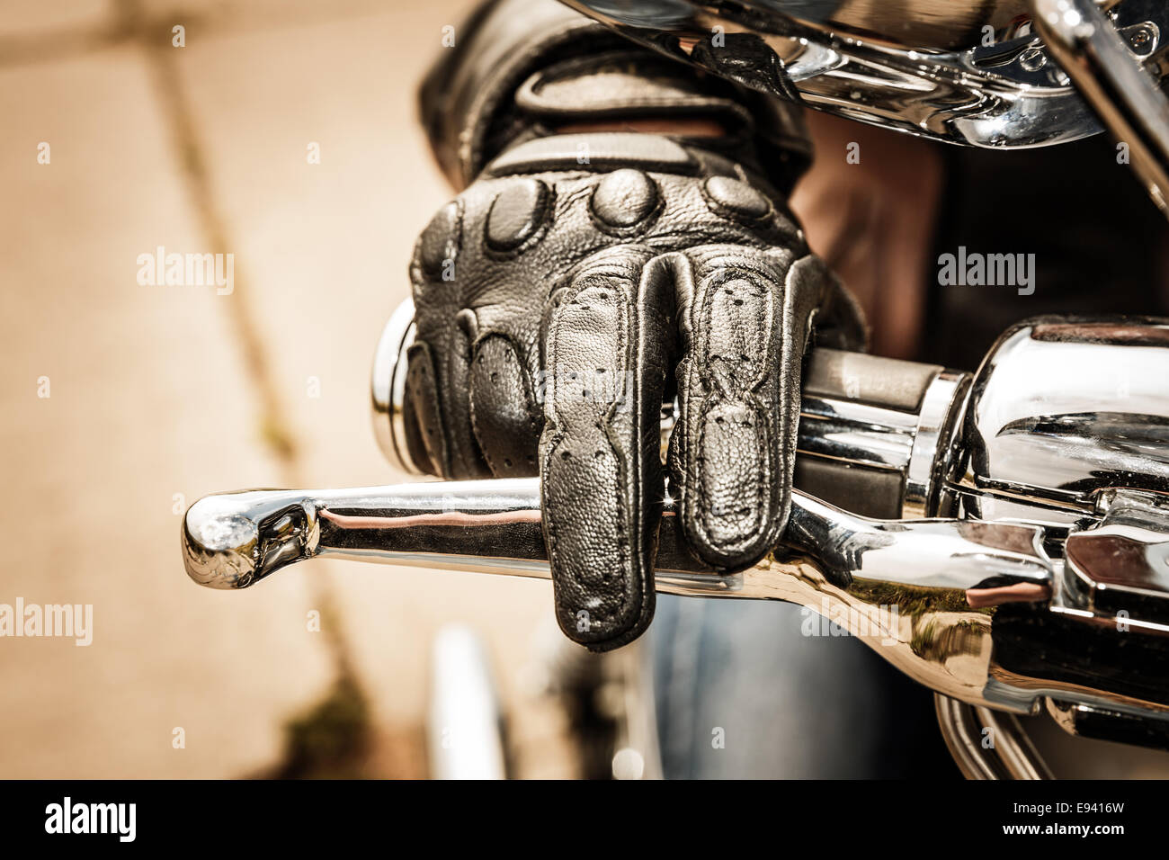 Human hand in a Motorcycle Racing Gloves holds a motorcycle throttle ...