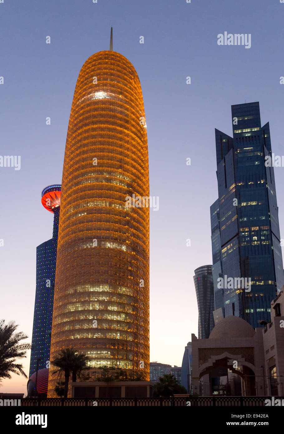One of Qatar's skyscrapers lit up with golden light at sunset Stock ...