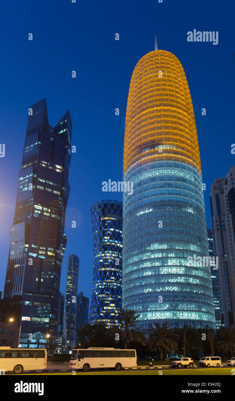 Towers in Doha, Qatar, lit up at sunset Stock Photo - Alamy