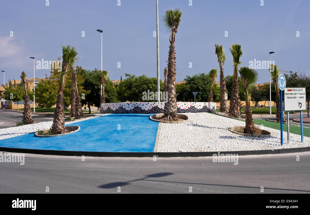 Colourful roundabout in red, green and blue in Spain Stock Photo - Alamy