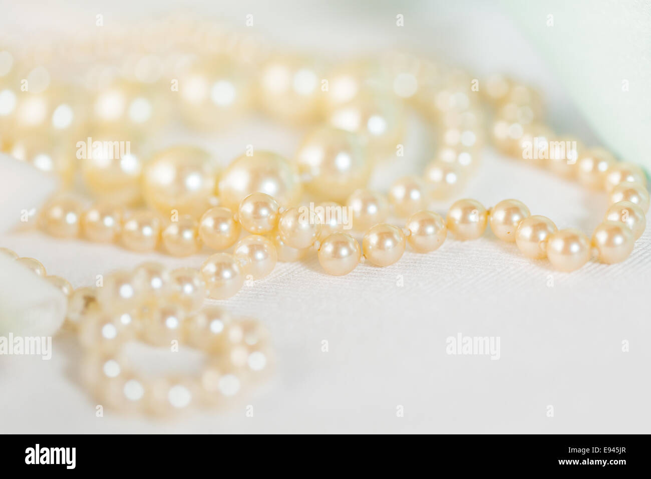 White vintage pearls on the table Stock Photo - Alamy