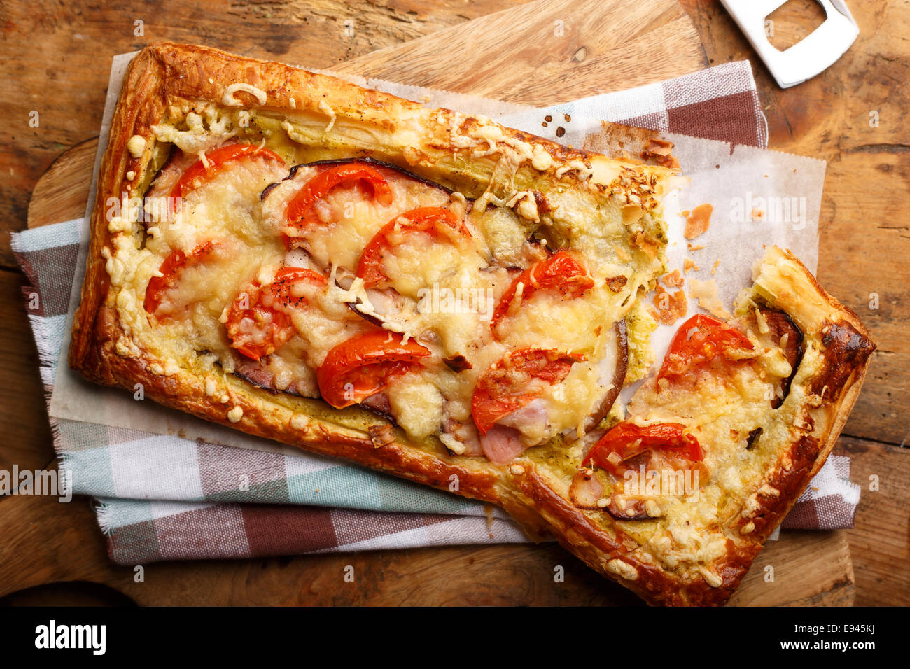 Tasty square pie with tomatoes,bacon and cheese Stock Photo - Alamy