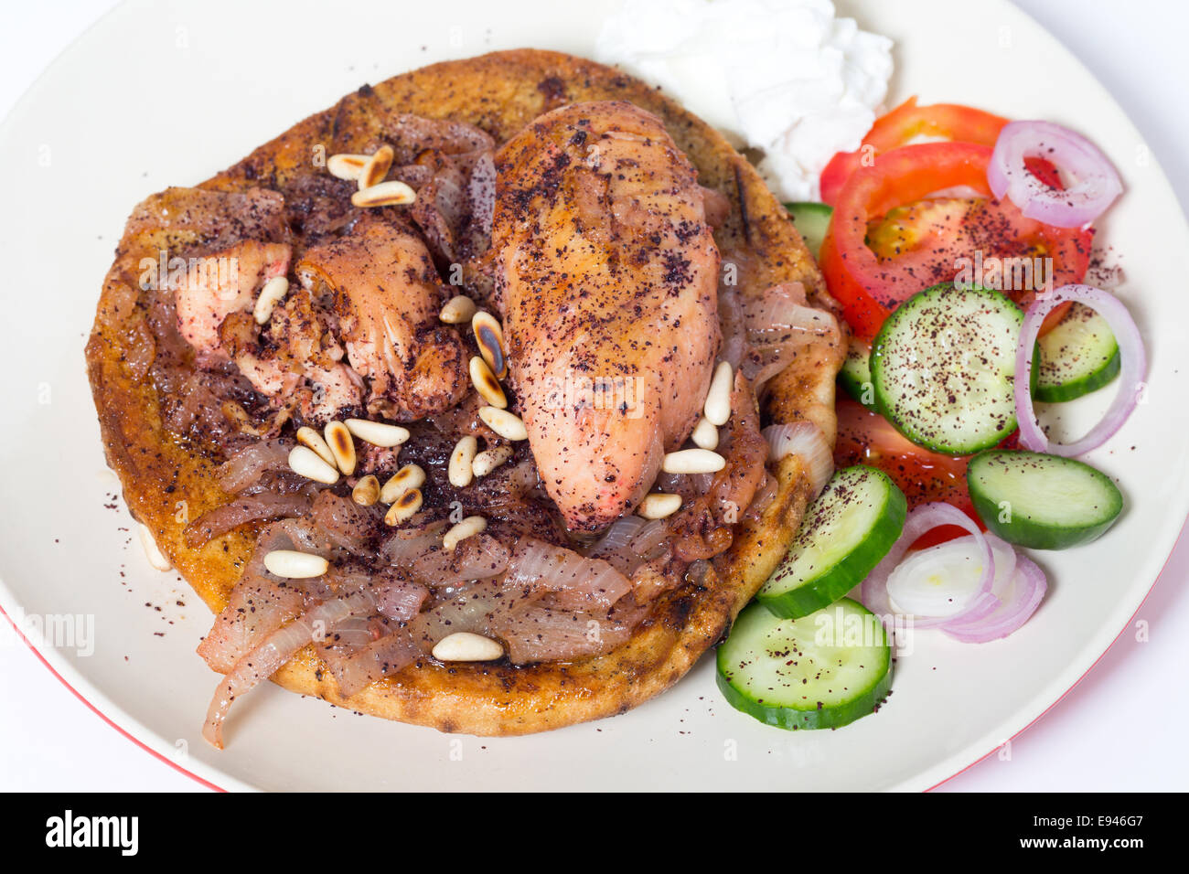 Musakhan, traditional Palestinian sumac chicken, on a plate with a ...