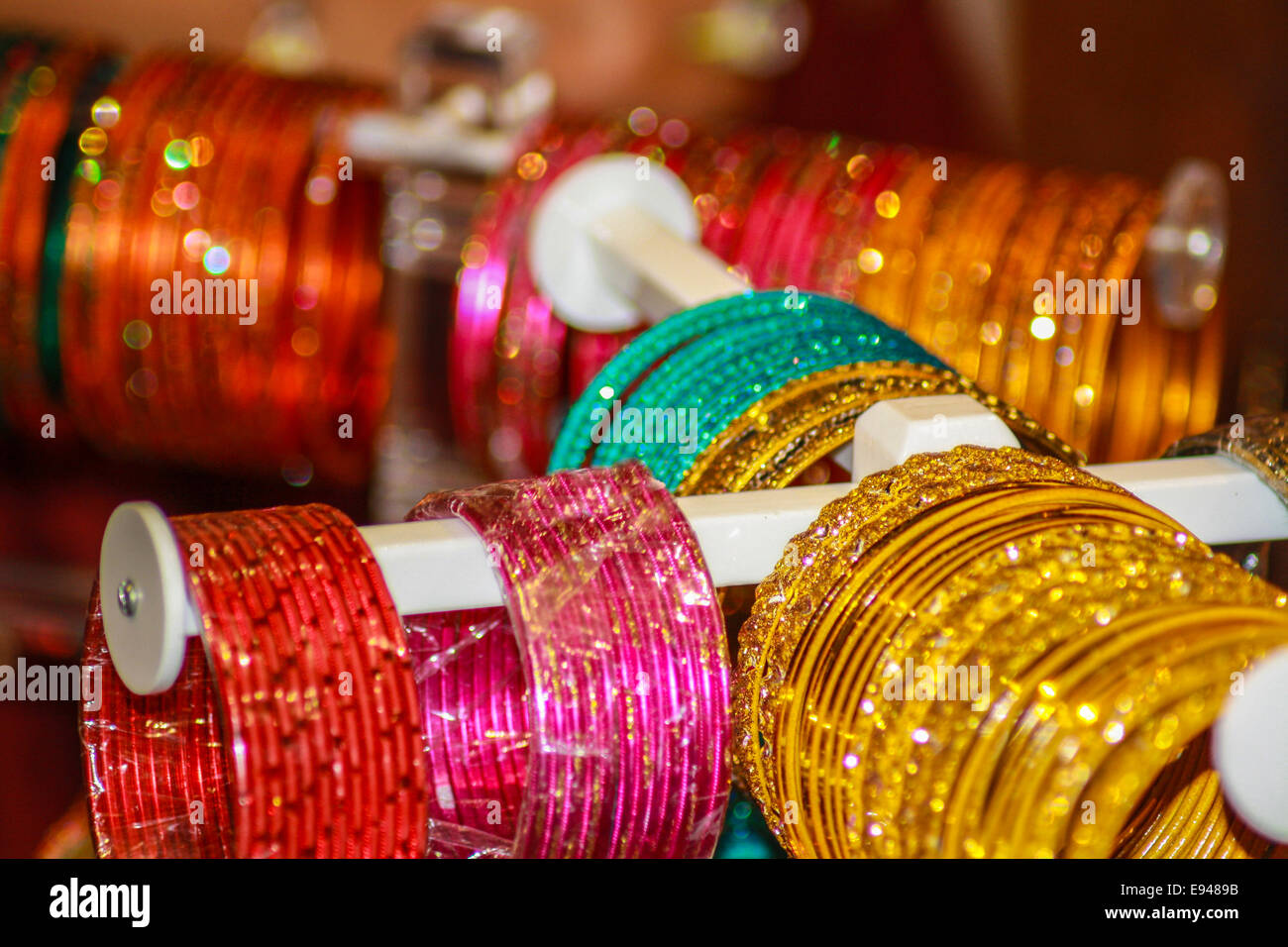 bangles indian dress arm wear colourful gold red pink aqua on rack ...