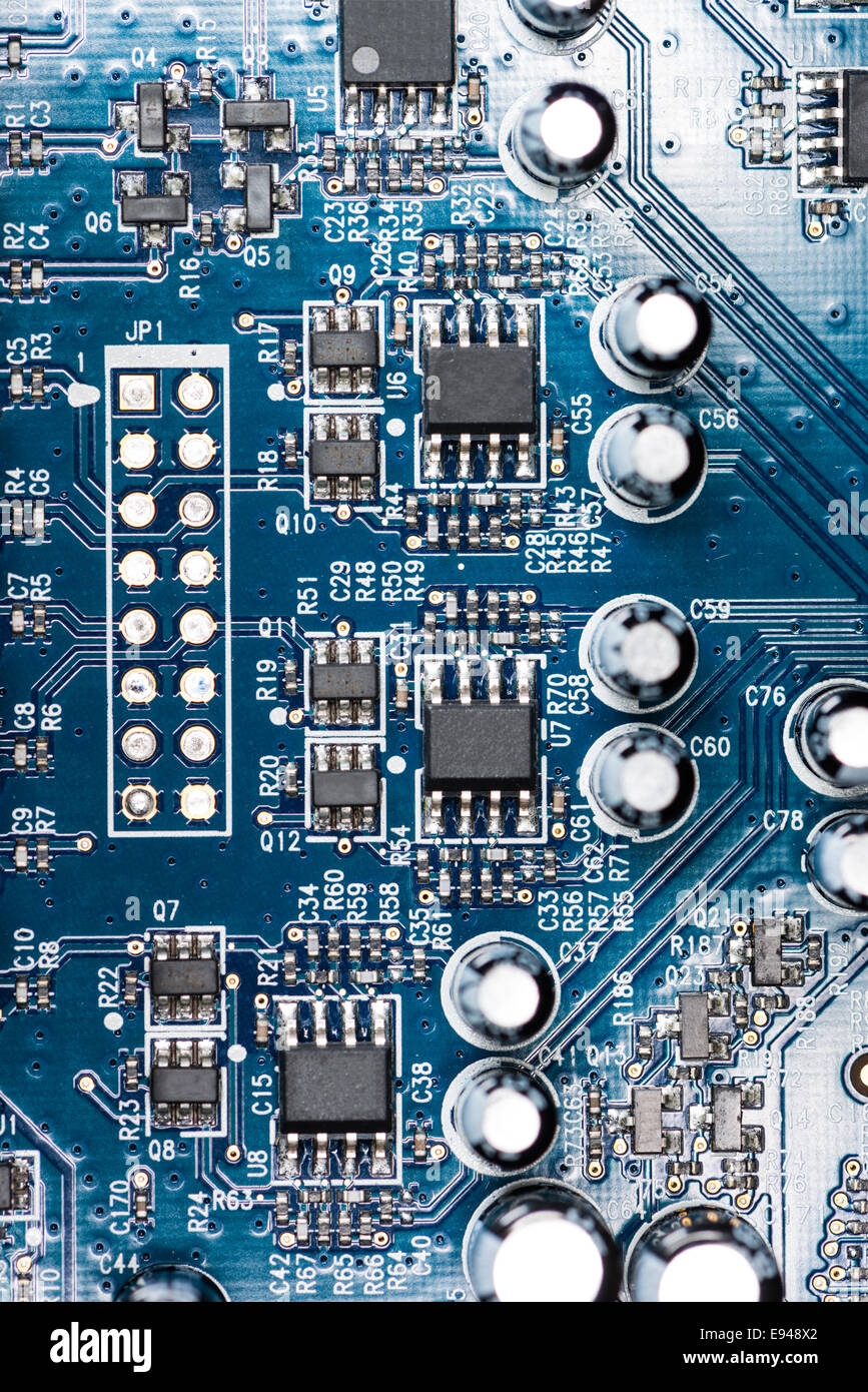 Chips on a blue PCB (detailed close-up shot Stock Photo - Alamy