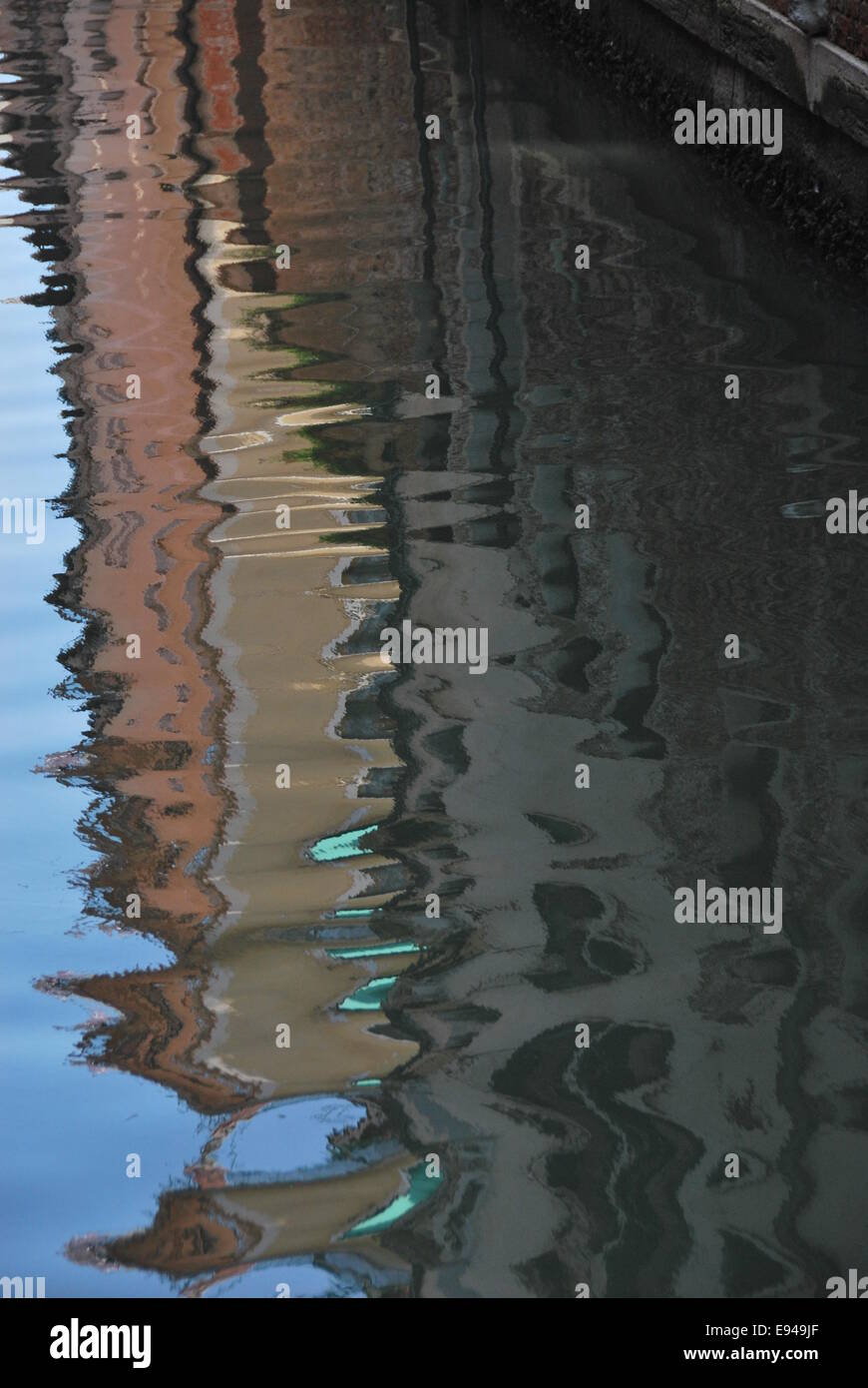 Italy. Venice. reflection of an ancient building. worn wood, crumbling ...
