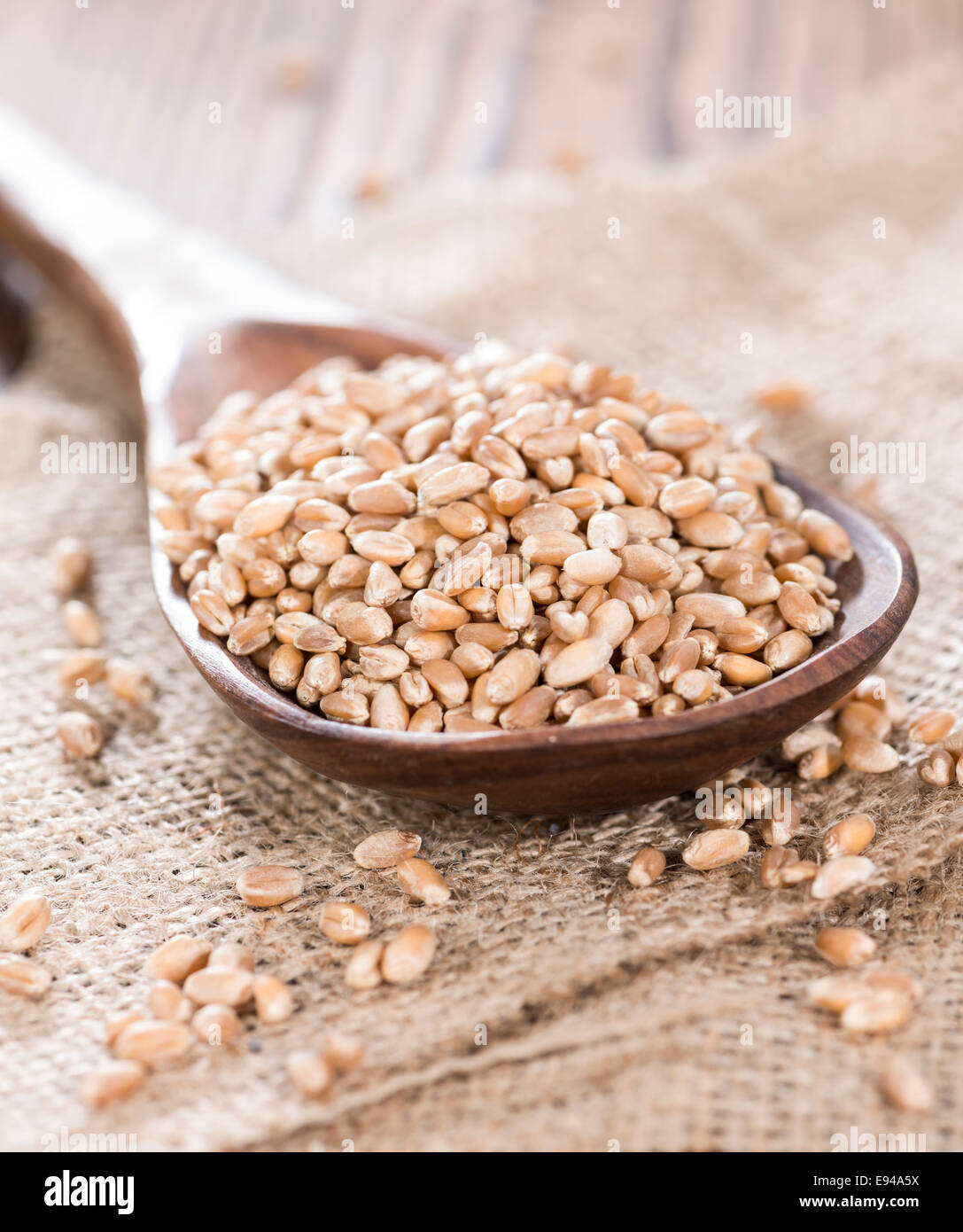 Portion of Wheat Grains (close-up shot) on dark wooden background Stock ...