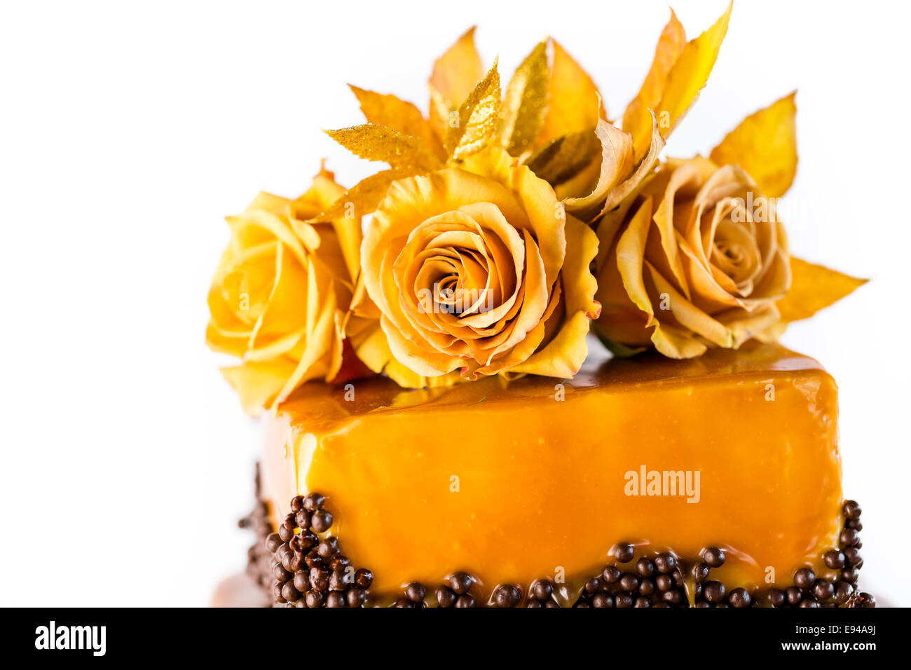 Gourmet tiered wedding cake as centerpiece at the wedding reception ...