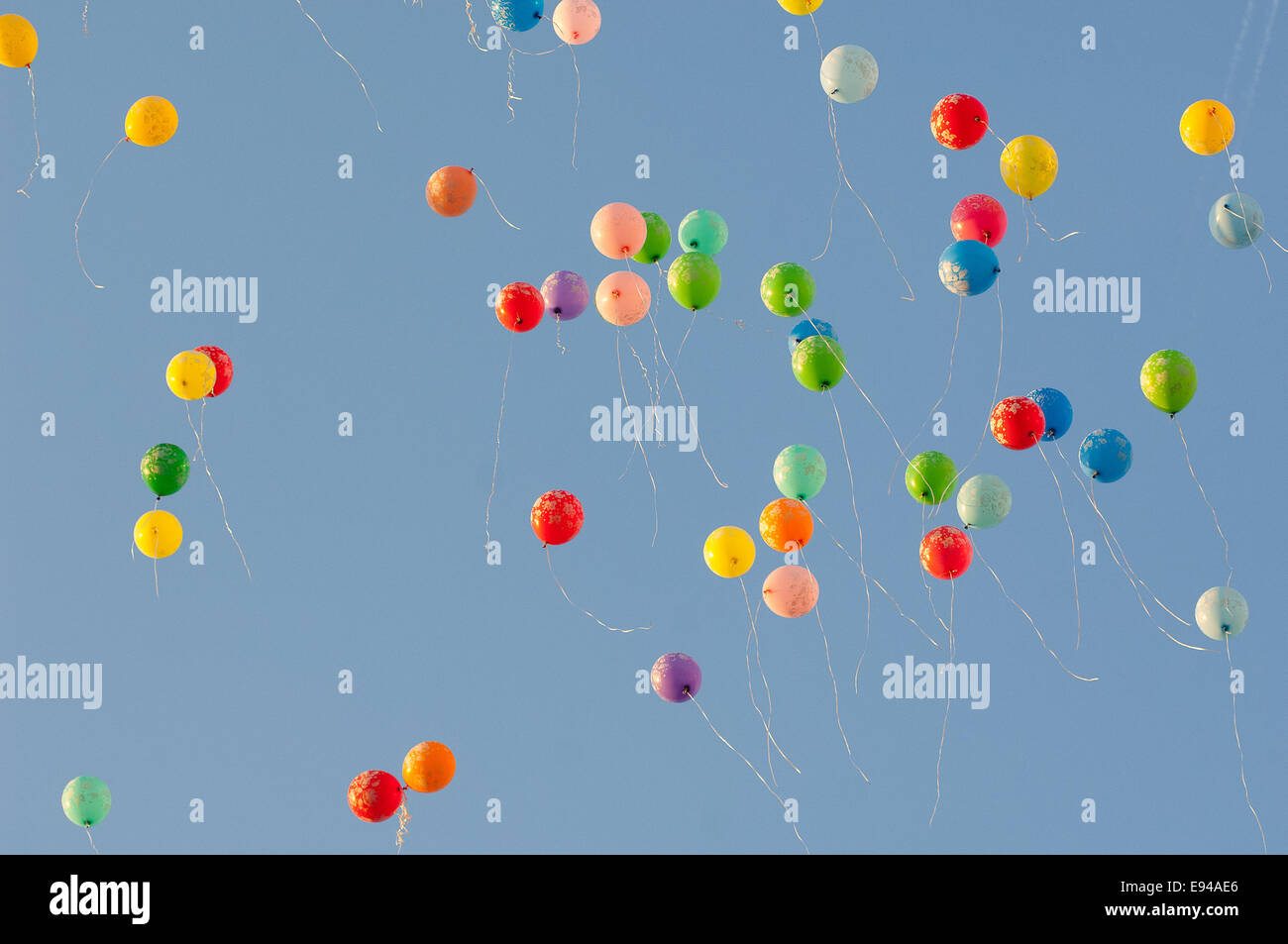 Baloons in air on sunny summer day against blue sky Stock Photo - Alamy