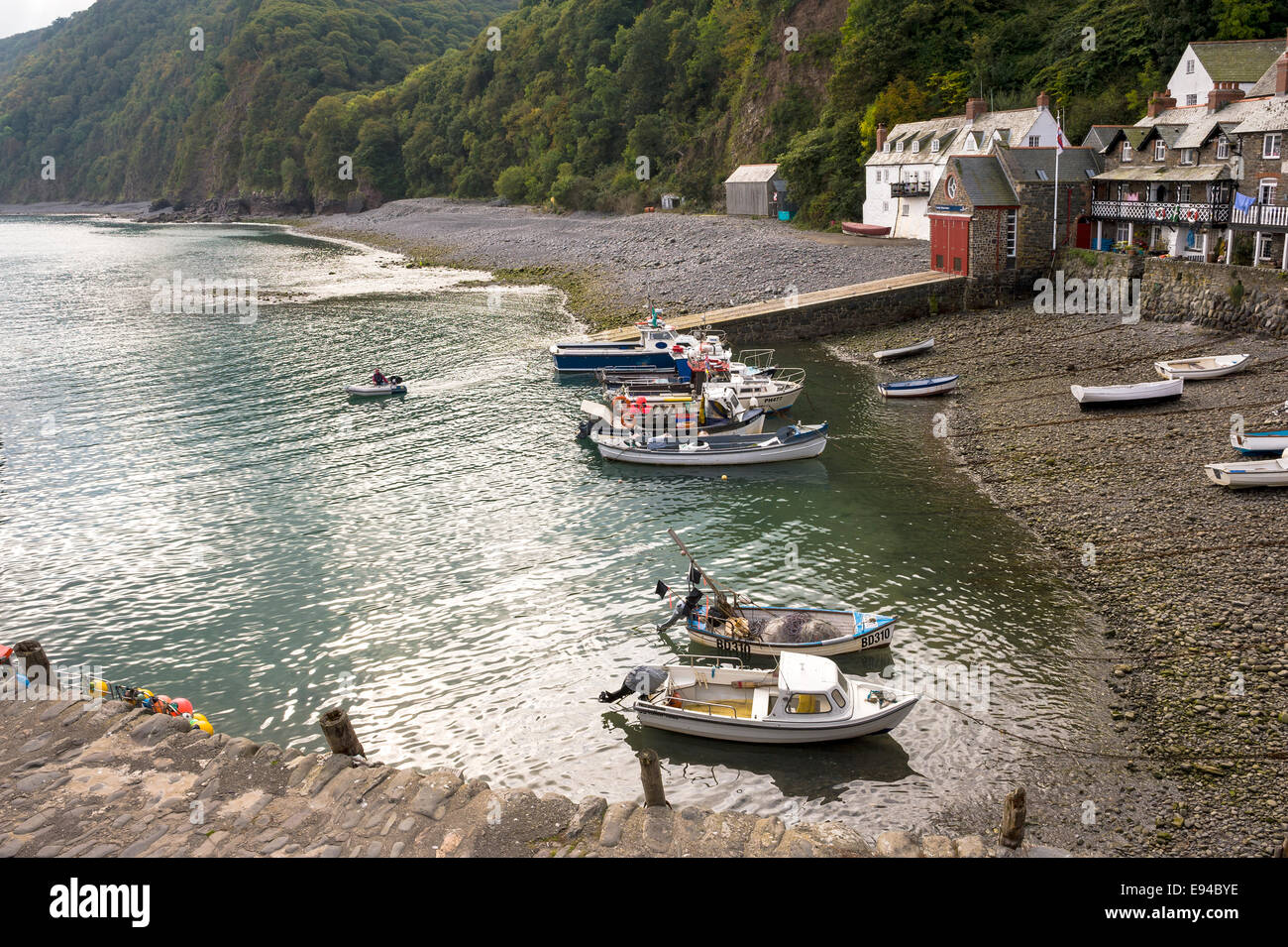 A small craft making it's way across the harbour towards a larger ...