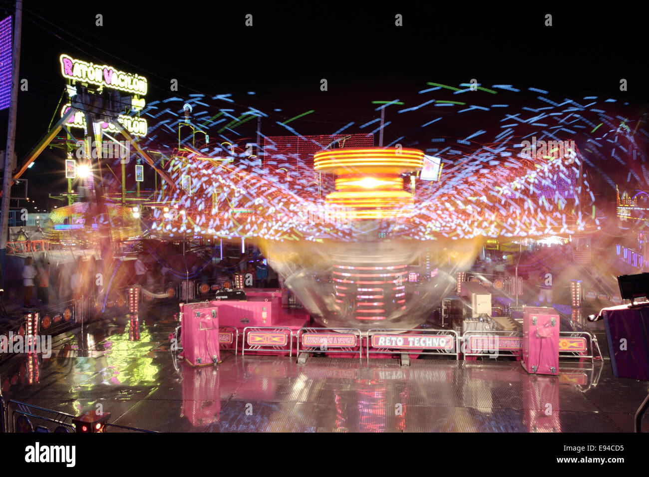 Long exposure of fairground ride at night Stock Photo - Alamy