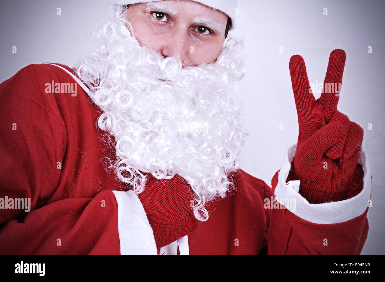Santa Clause Showing Peace Sign Stock Photo - Alamy