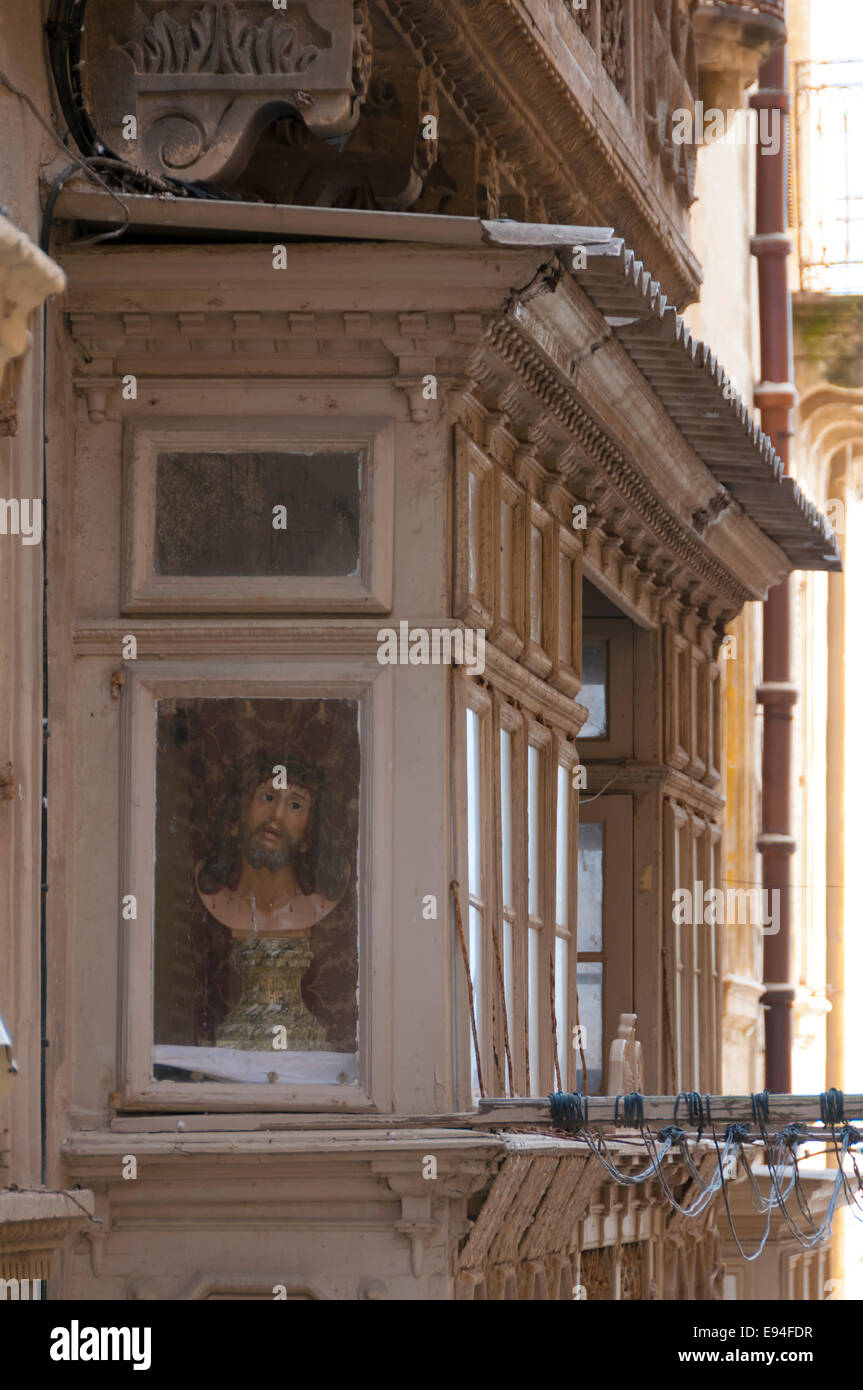 A bust of Jesus, staring through a dirty window in Valletta, the ...