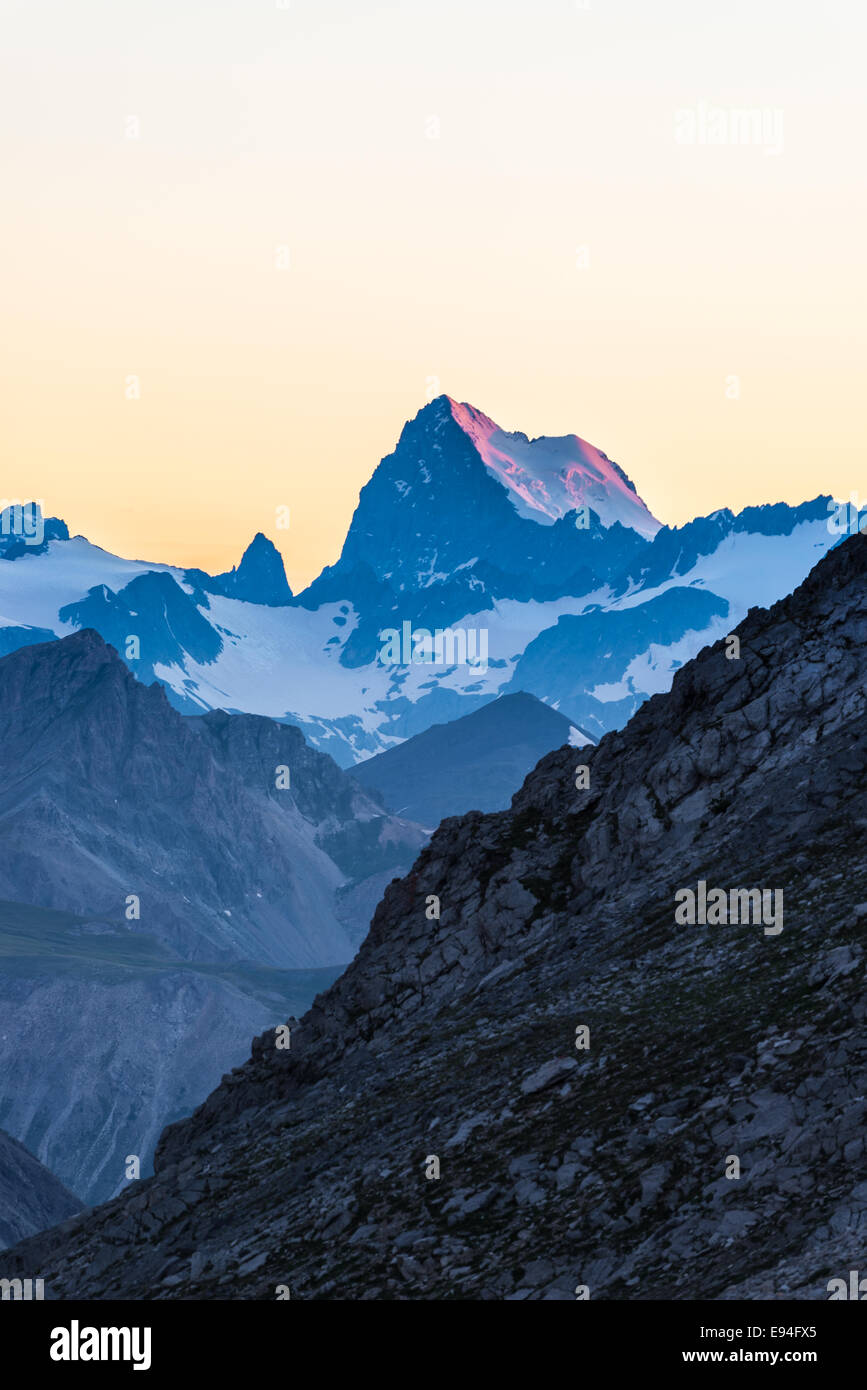 High altitude alpine landscape at dawn with first light glowing the ...