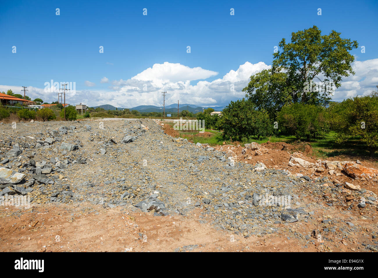 Construction site against a blue sky in Greece with dirt and excavated ...