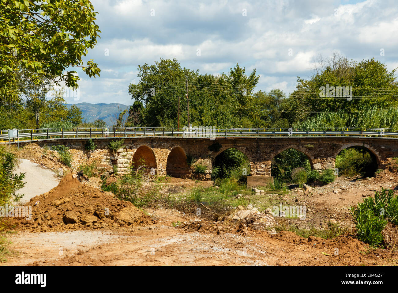 Construction site against a blue sky in Greece with dirt and excavated ...