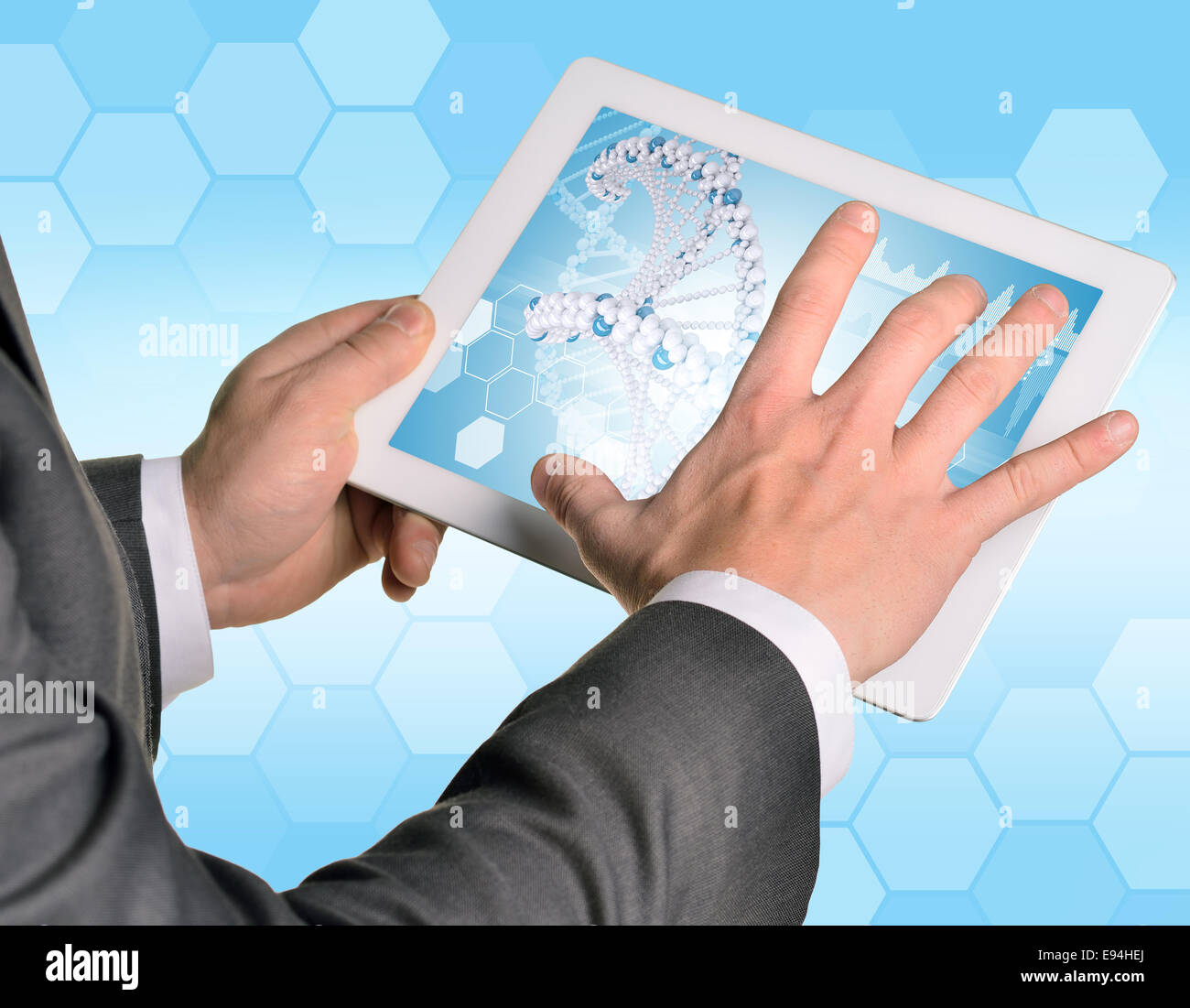 Man hands using tablet pc. Image of DNA helix on screen Stock Photo - Alamy