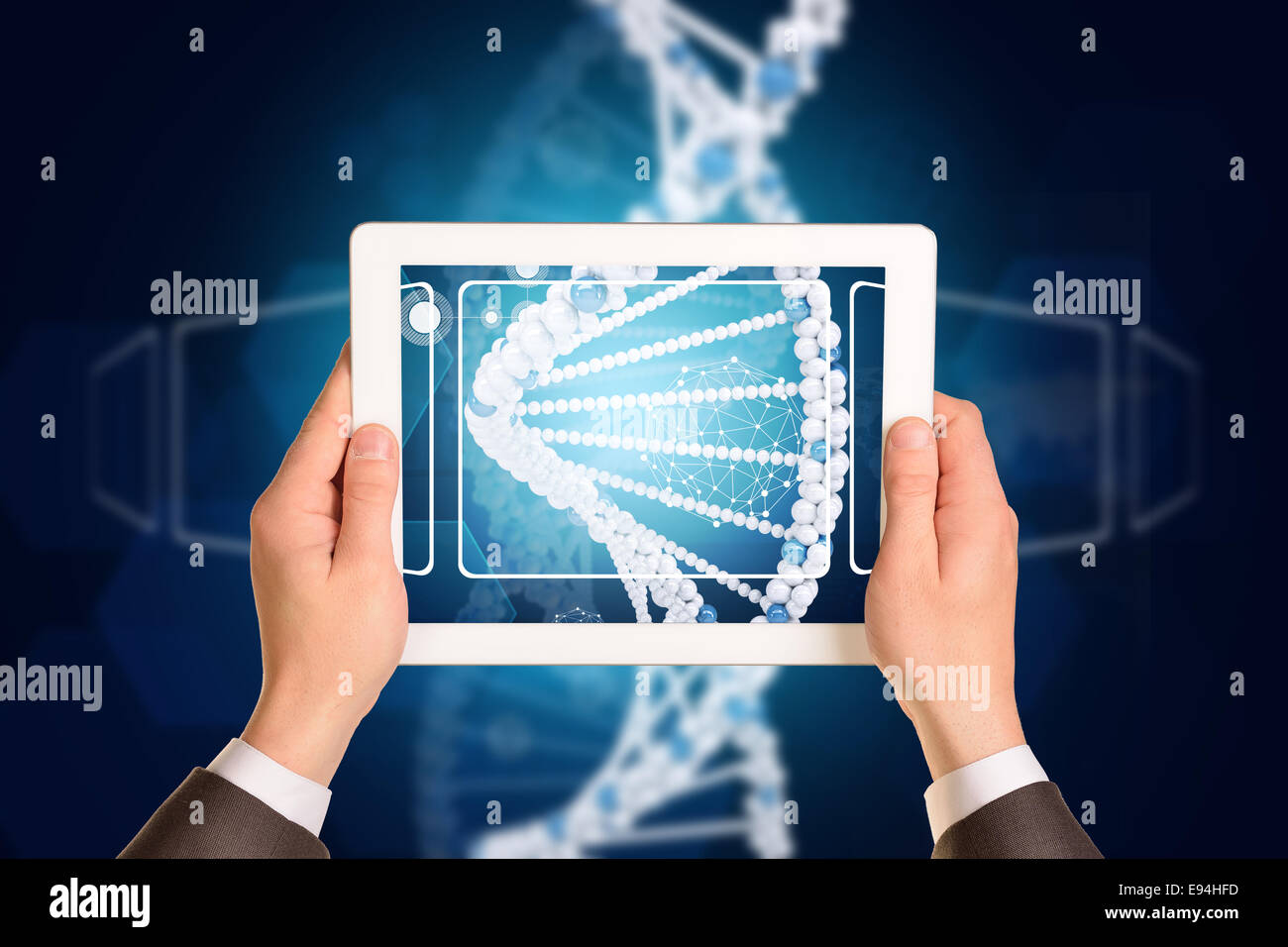 Man hands using tablet pc. Image of DNA helix on screen Stock Photo - Alamy